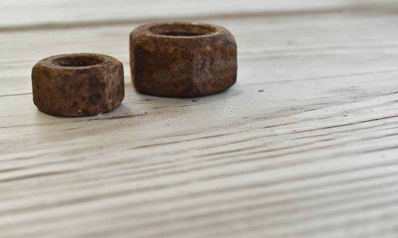 Rusted Nuts stock photo. Image of woodgrain, space, large - 56331620