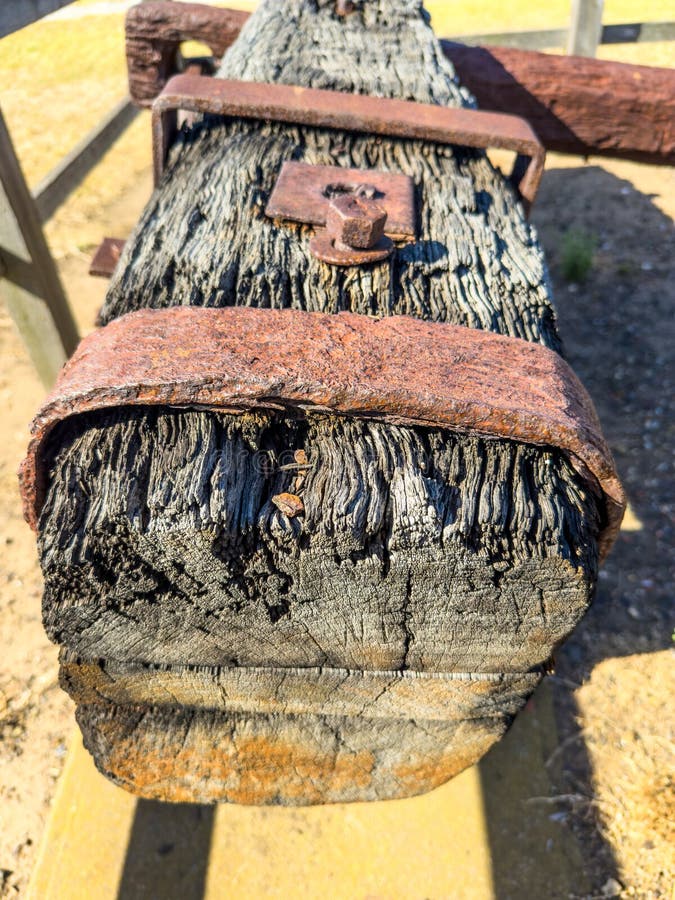 A Rusted Piece of Iron Strapped To a Very Decayed Wooden Beam Stock ...