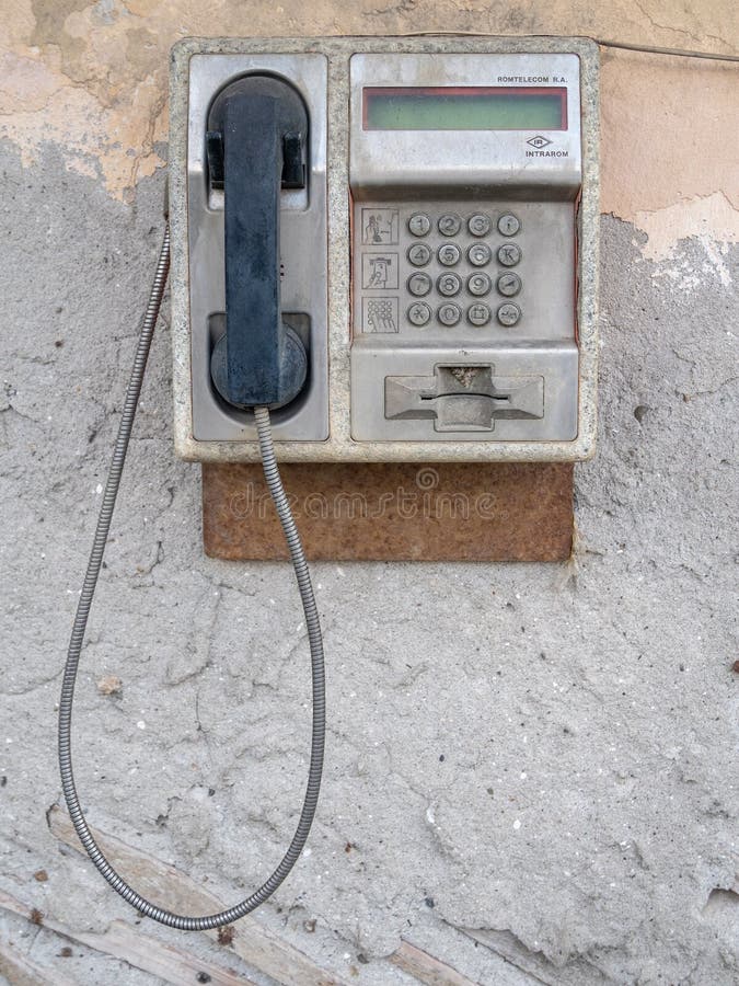 Rusted Public Telephone Hanging on a Wall Stock Image - Image of ...