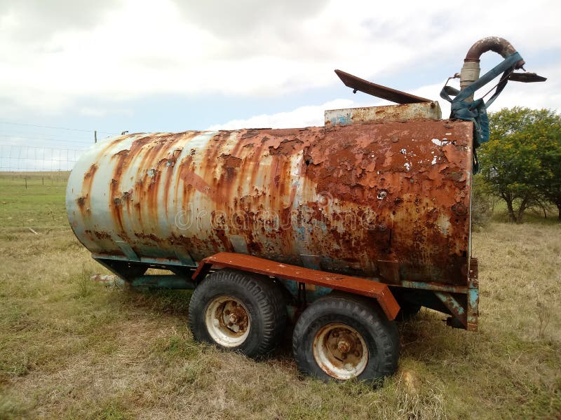 Rusted Water Tanker Four Wheels Stock Photo - Image of wheels, rusted ...