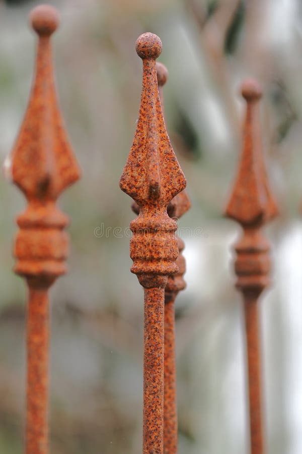 Rusted and Weathered Iron Fence Pole Tips Stock Photo - Image of tips ...