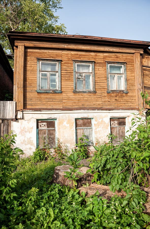 Rustic, Abandoned House with a Deteriorating Facade and Broken and ...