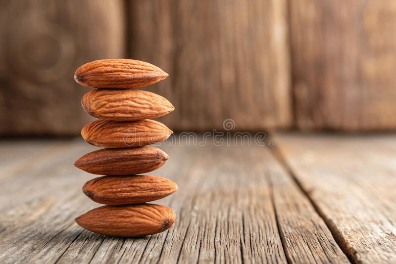 A Stack of Almonds Over Rustic Background Stock Image - Image of autumn ...