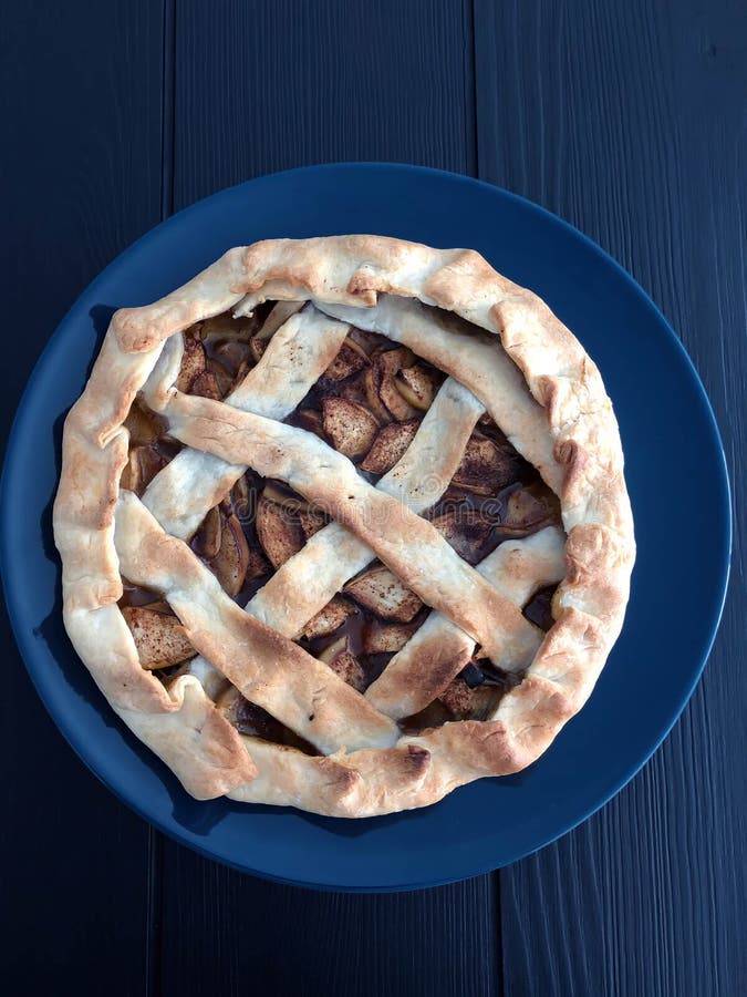 A Rustic Apple Pie with a Lattice Crust, Served on a Blue Plate ...