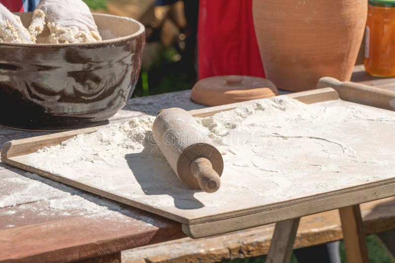 Rustic Baking Setup with Rolling Pin and Flour on Wooden Surface Stock ...