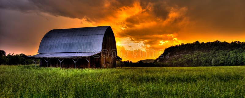 Rustic Barn Against a Dramatic Sunset Sky Stock Photo - Image of ...