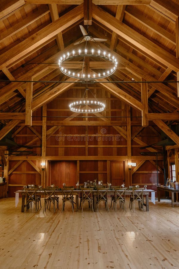 Rustic Barn Hall with Chairs and Elegant Chandelier Stock Photo - Image ...