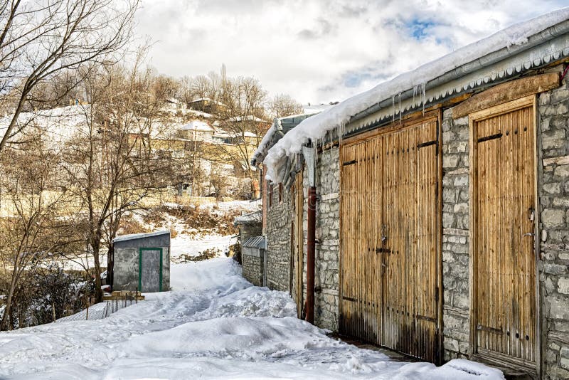 Rustic barn in snow stock photo. Image of stone, clouds - 67882402