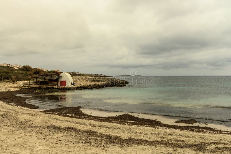 Rustic Beach Hut at Cala Binibeca Shoreline, Menorca Stock Photo ...