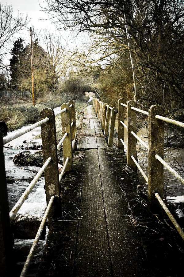 Old Rustic Bridge Of Wooden Planks On A Metal Base With Iron Handrails ...