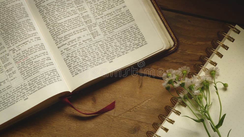 Rustic Bible on a Wooden Background with Notepad and Flowers Stock ...