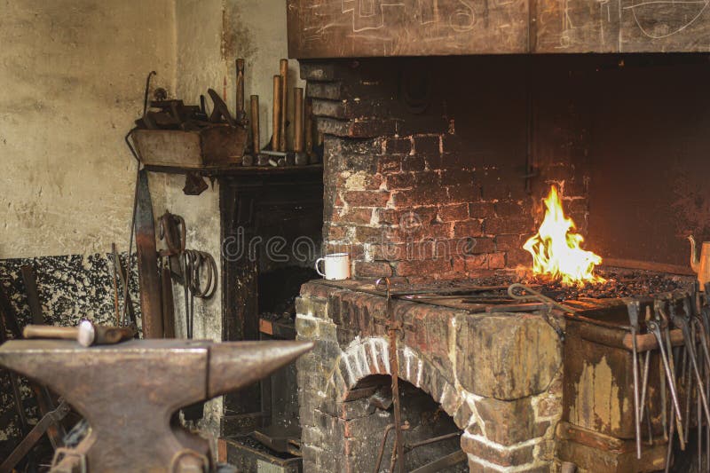 Rustic Blacksmith Forge with Anvil and Glowing Fire Stock Photo - Image ...