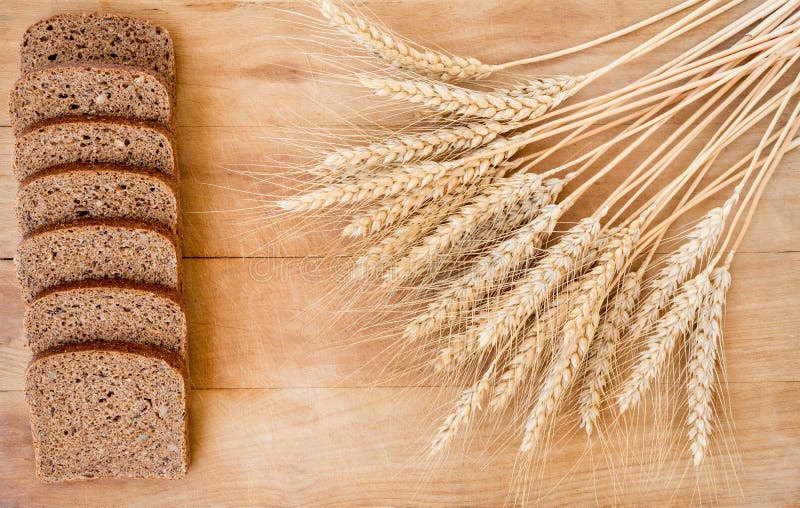 Rustic Bread and Wheat on an Old Vintage Wood Table Stock Photo - Image ...
