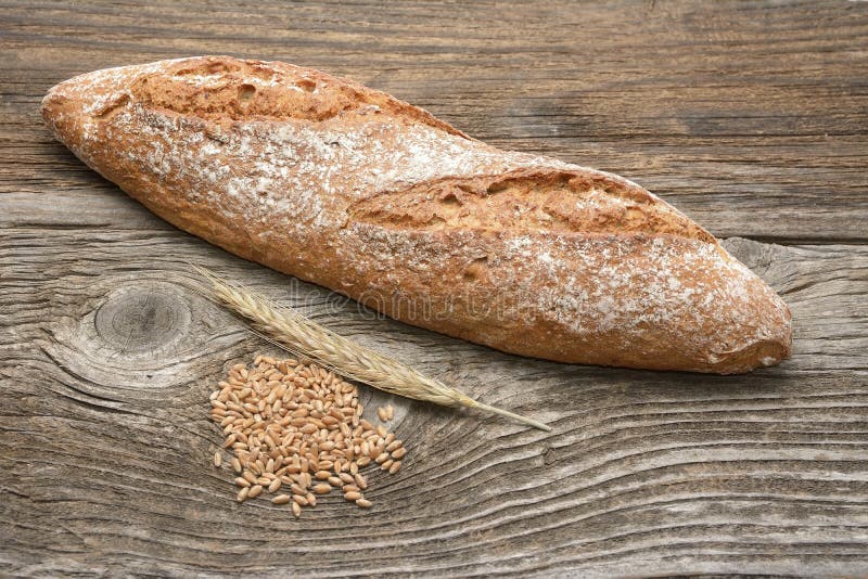 Rustic Bread and Wheat on an Old Wood Table. Stock Image - Image of ...