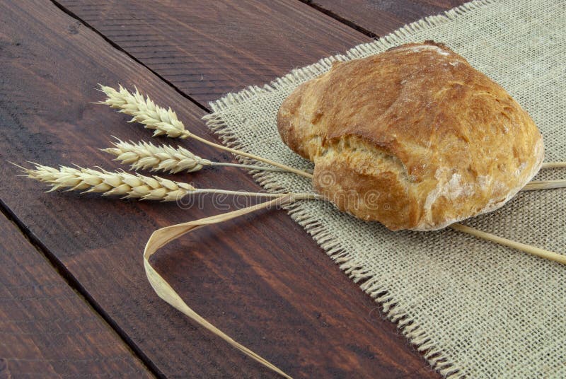 Rustic Bread on Wooden Table Stock Photo - Image of bread, isolated ...