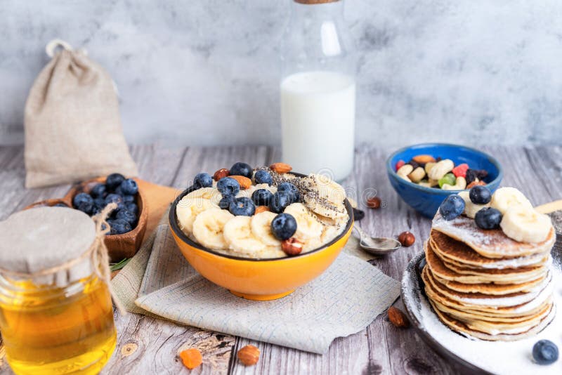 Rustic Breakfast Pancakes on a Plate with Blueberries and Oatmeal Stock ...