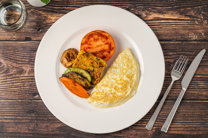 Rustic Breakfast Plate with Fried Eggs, Grilled Vegetables, and Turkey ...