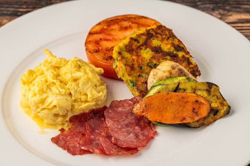 Rustic Breakfast Plate with Fried Eggs, Grilled Vegetables, and Turkey ...