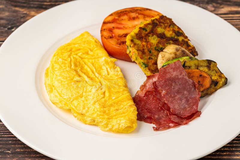 Rustic Breakfast Plate with Fried Eggs, Grilled Vegetables, and Turkey ...