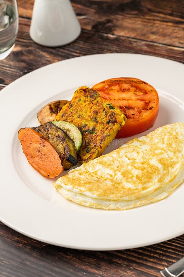 Rustic Breakfast Plate with Fried Eggs, Grilled Vegetables, and Turkey ...