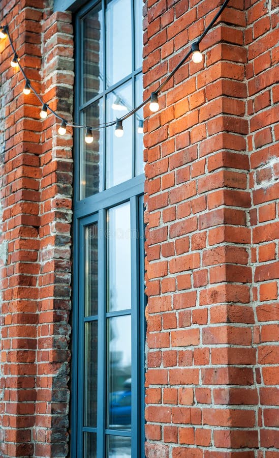 Rustic Brick Facade with Glowing String Lights Creates a Cozy Evening ...