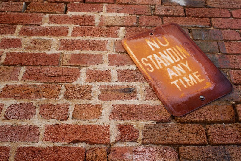Rustic Brick No Standing Any Time Sign Stock Photo - Image of natural ...