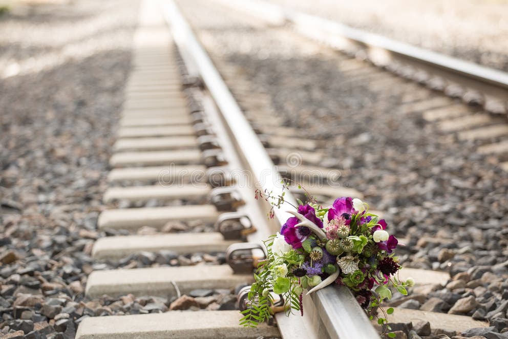 Rustic Bridal Bouquet on Railroad Tracks Stock Photo - Image of holding ...