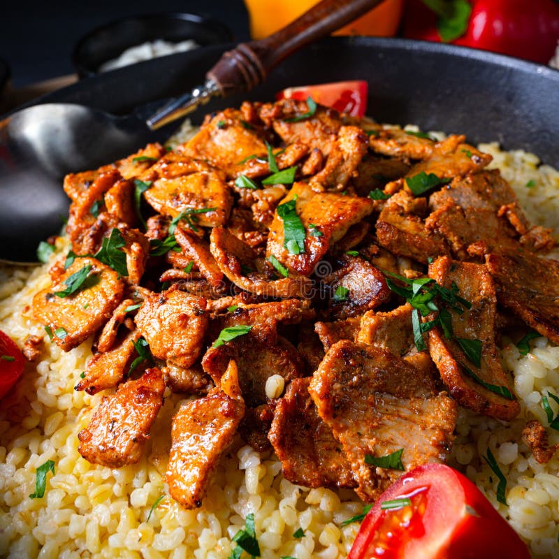 Rustic Bulgur Pans with Gratinated Gyros and Yoghurt Stock Photo ...