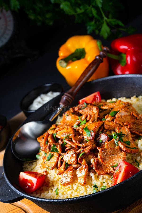 Rustic Bulgur Pans with Gratinated Gyros and Yoghurt Stock Photo ...