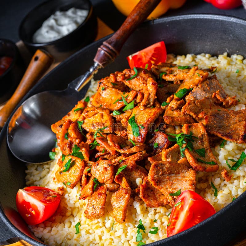 Rustic Bulgur Pans with Gratinated Gyros and Yoghurt Stock Image ...