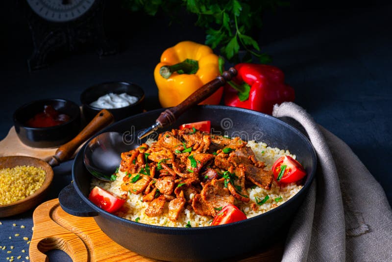 Rustic Bulgur Pans with Gratinated Gyros and Yoghurt Stock Image ...