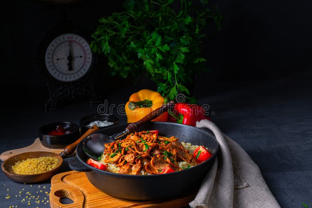 Rustic Bulgur Pans with Gratinated Gyros and Yoghurt Stock Photo ...