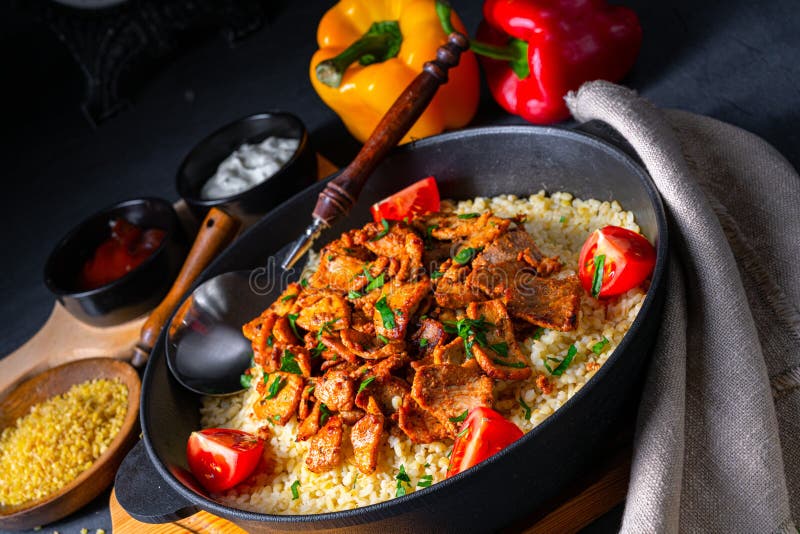 Rustic Bulgur Pans with Gratinated Gyros and Yoghurt Stock Photo ...