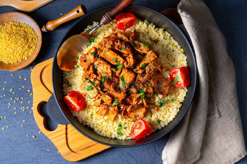 Rustic Bulgur Pans with Gratinated Gyros and Yoghurt Stock Photo ...