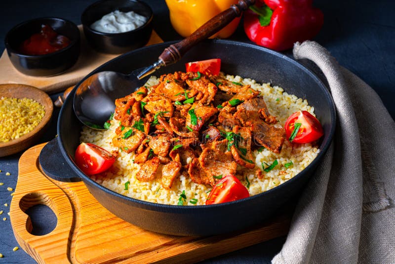 Rustic Bulgur Pans with Gratinated Gyros and Yoghurt Stock Image ...