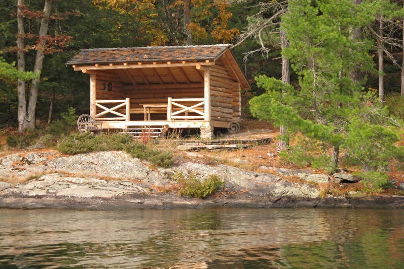 Rustic cabin by a lake stock photo. Image of shack, cottage - 6800764