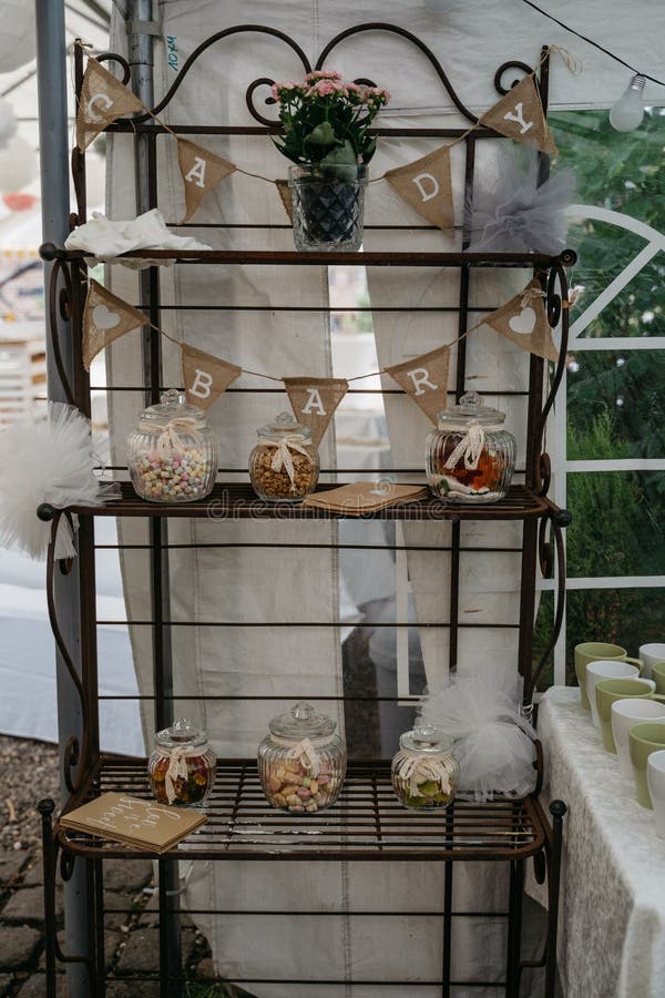 Rustic Candy Bar Setup with Bunting and Jars. Stock Photo - Image of ...