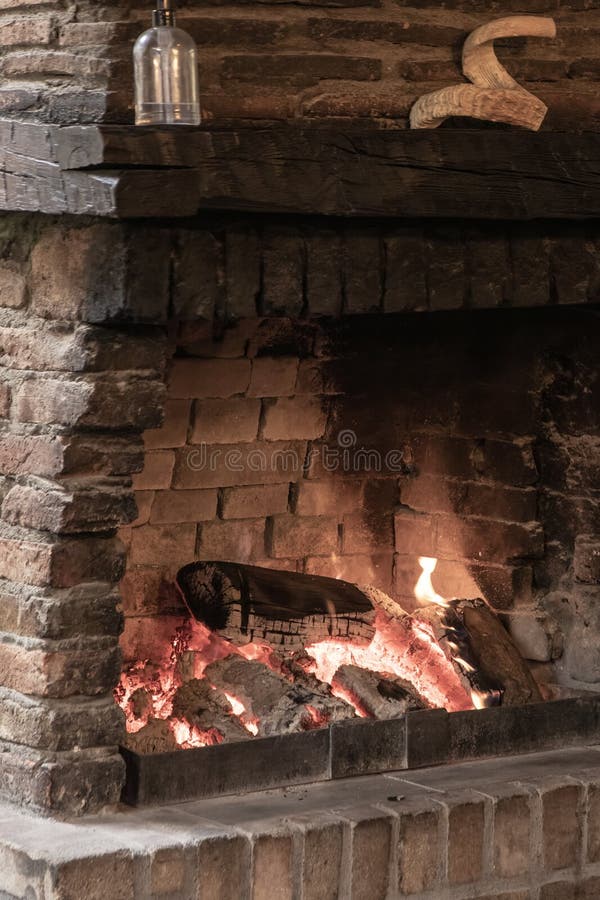 Rustic Charm: Cozy Fireplace Illuminates a Country Interior Stock Image ...