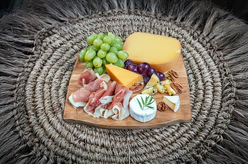 Rustic Cheese Board with Assorted Delights Stock Image - Image of ...
