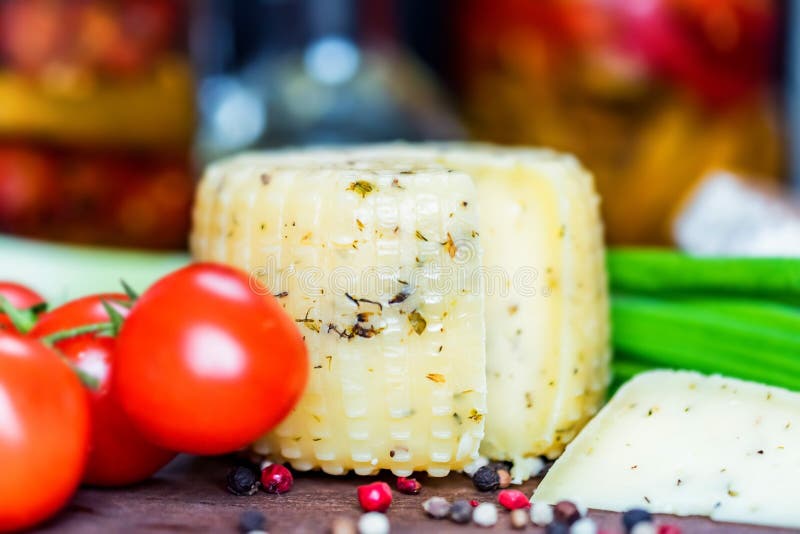 Rustic Cheese with Herbs, Pepper and Vegetables Stock Photo - Image of ...