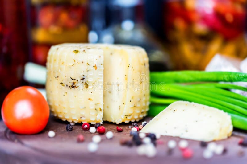 Rustic Cheese with Herbs, Pepper and Vegetables Stock Photo - Image of ...