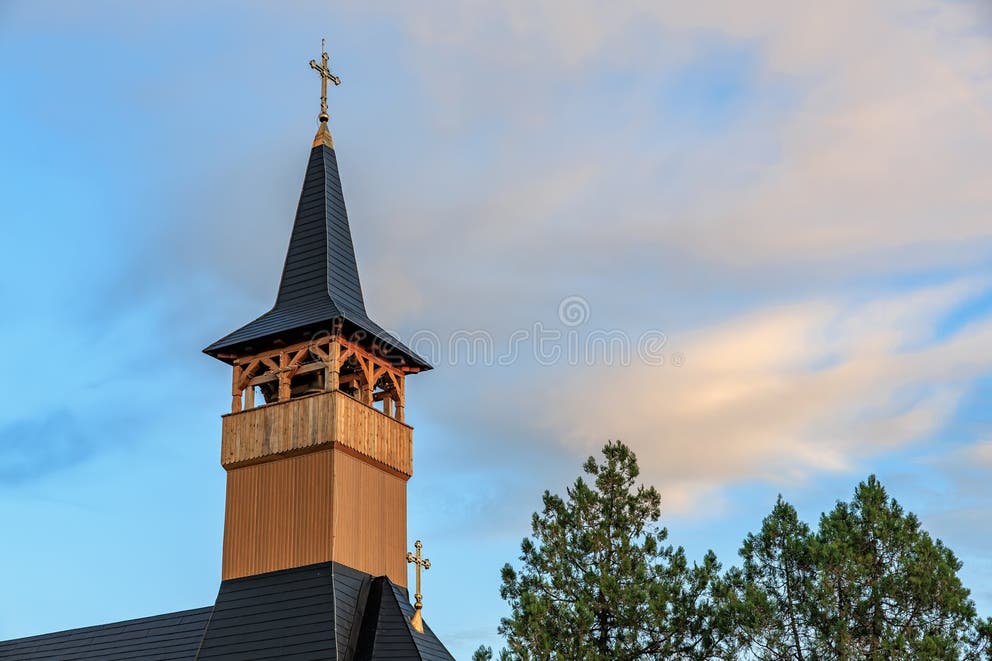 Rustic Church Steeple Against a Tranquil Sky with Pine Trees Stock ...