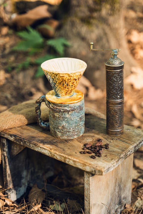 Rustic Coffee Brewing Setup with Handcrafted Filter and Grinder Stock ...