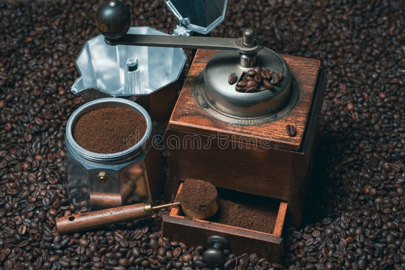 Rustic Coffee Grinder with a Measuring Spoon and an Espresso Maker with ...