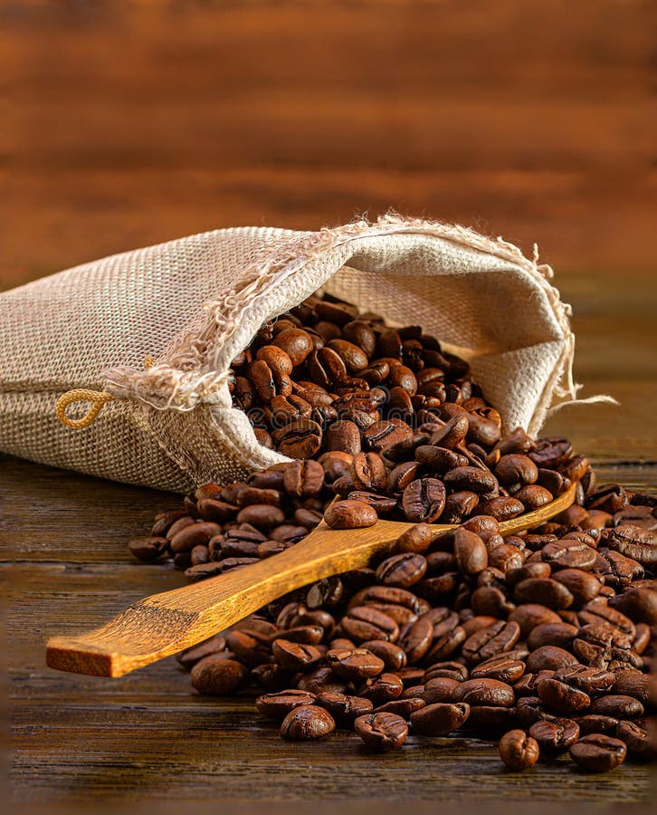 Rustic Coffee Sack on a Dark Wood Surface. Stock Image - Image of ...