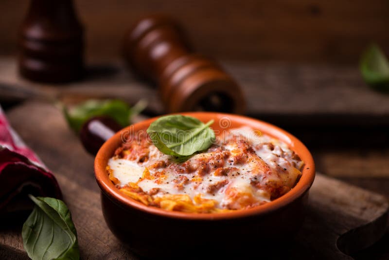 Rustic Lasagna on wood stock photo. Image of basil, dish - 123479900