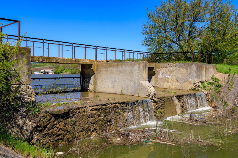 Rustic Concrete Bridge with Waterfall Over River in Nature Stock Image ...