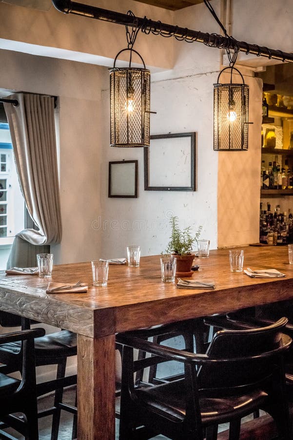 Rustic Country Style Restaurant with White Walls, Table Seating and ...