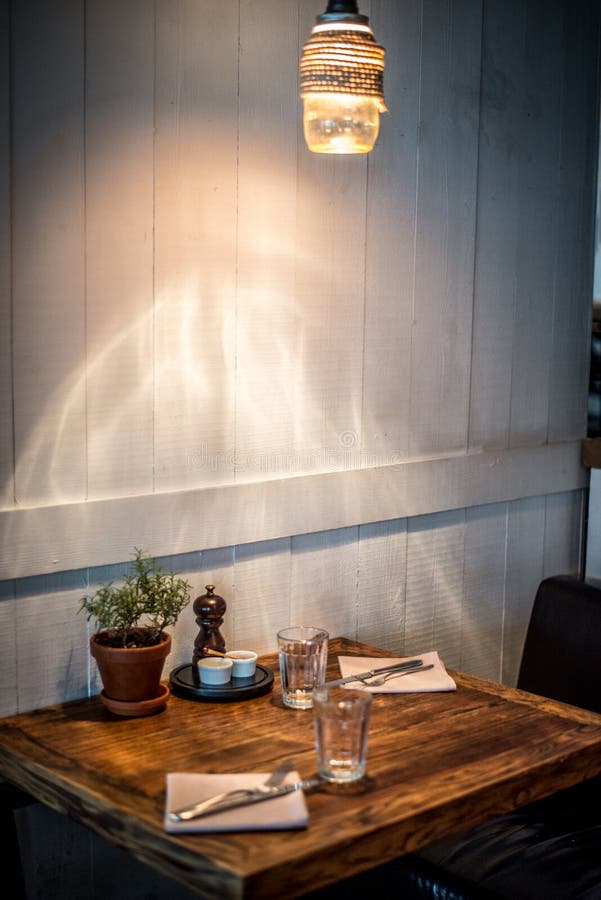 Rustic Country Style Restaurant with White Walls, Table Seating and ...