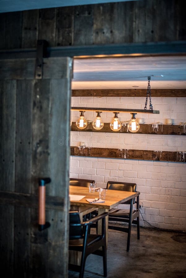 Rustic Country Style Restaurant with White Walls, Table Seating and ...
